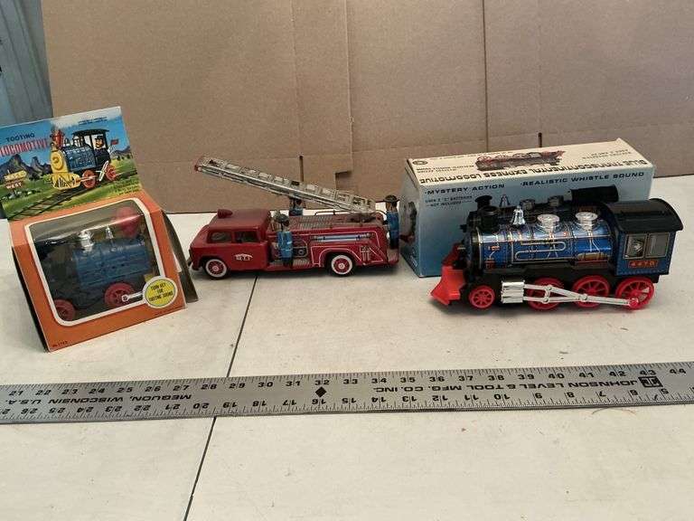 Vintage tin fire engine, and locomotives - Legacy Auction Company