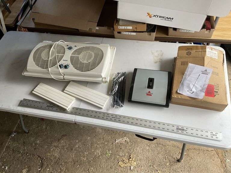 New Bissell sweeper and window fan - Legacy Auction Company