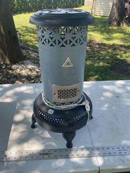 Vintage perfection heater with modern light - Legacy Auction Company