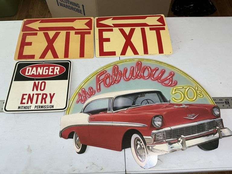 Plastic EXIT signs and cardboard signs - Legacy Auction Company