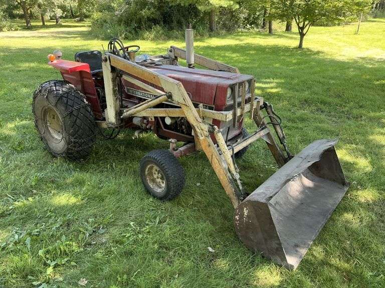 International 284 tractor w/loader - Legacy Auction Company