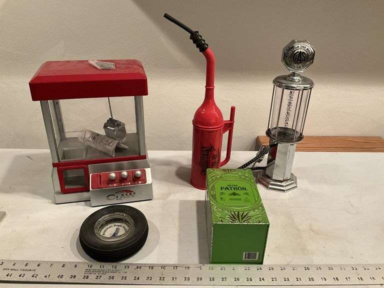 The claw arcade game, Goodyear ashtray, drink, - Legacy Auction Company