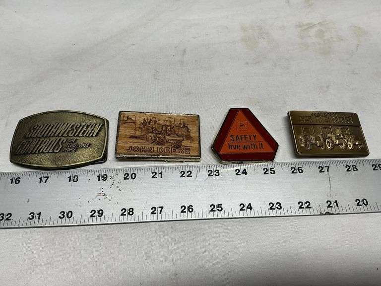 John Deere belt buckles - Legacy Auction Company