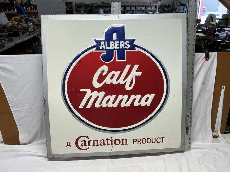Vintage metal Carnation Albers Calf Manna sign - Legacy Auction Company