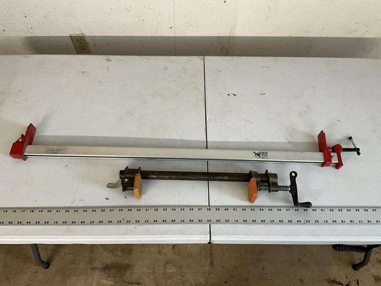 Shop fox 36" bar clamp and 13" pipe clamp - Legacy Auction Company