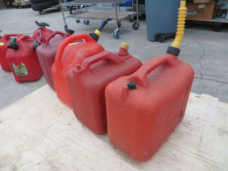 Four 5-Gallon Gas Cans - Lambrecht Auction, Inc.