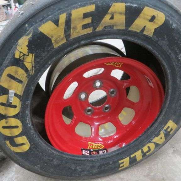 Three Goodyear Drag Slicks w/Rims 25.5x14.0-16 - Lambrecht Auction, Inc.