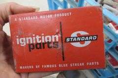 Crate Full of Spark Plugs, Electrical Components, etc. - Lambrecht ...