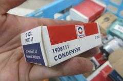 Crate Full of Spark Plugs, Electrical Components, etc. - Lambrecht ...