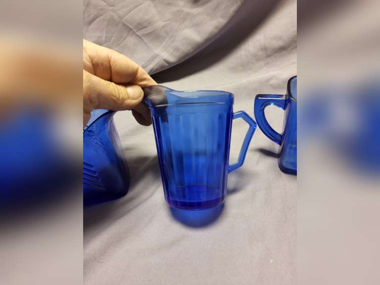 4 small vintage blue pitchers - Lindsay Auctions LLC