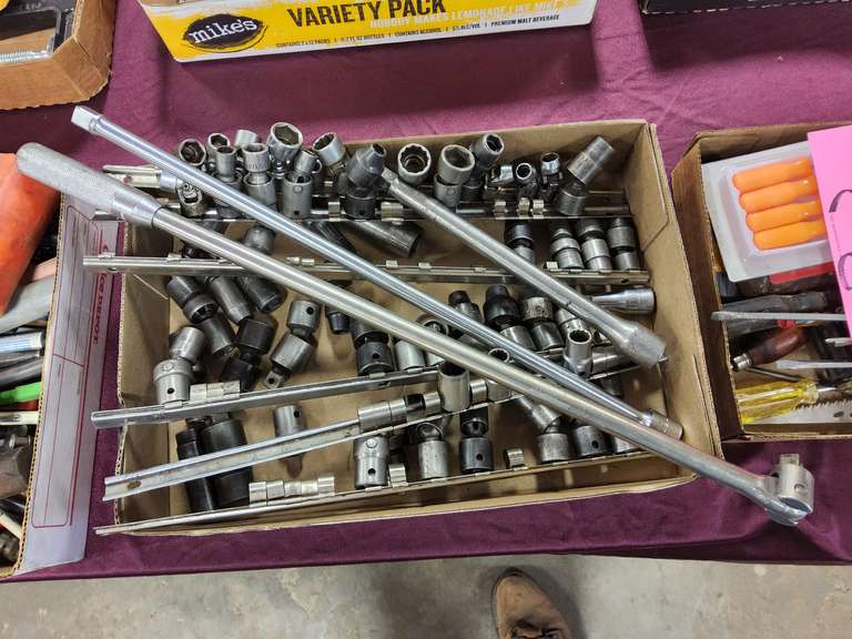 Flat of various size sockets, extensions, breaker bar & others ...