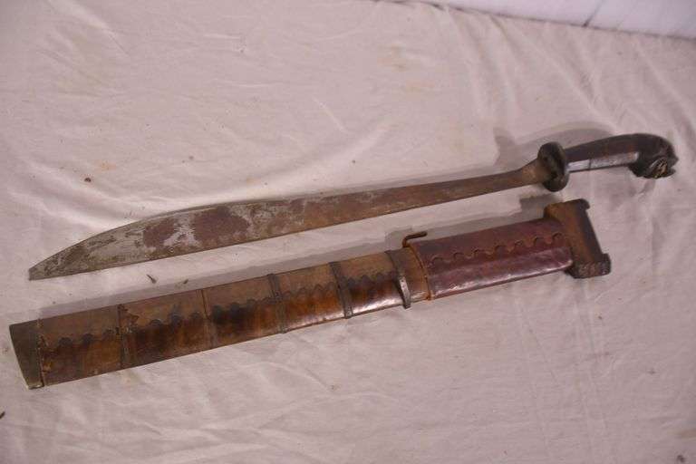 Sword with carved face handle and leather-wrapped wooden sheathe; 16669 ...