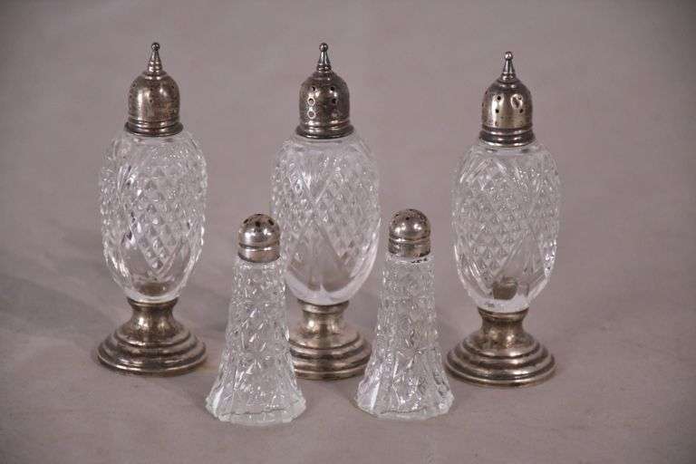Group of 5 salt and pepper shakers with sterling caps and bases; 68 ...