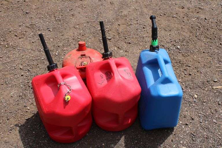 4 fuel containers - Lee Real Estate & Auction Service