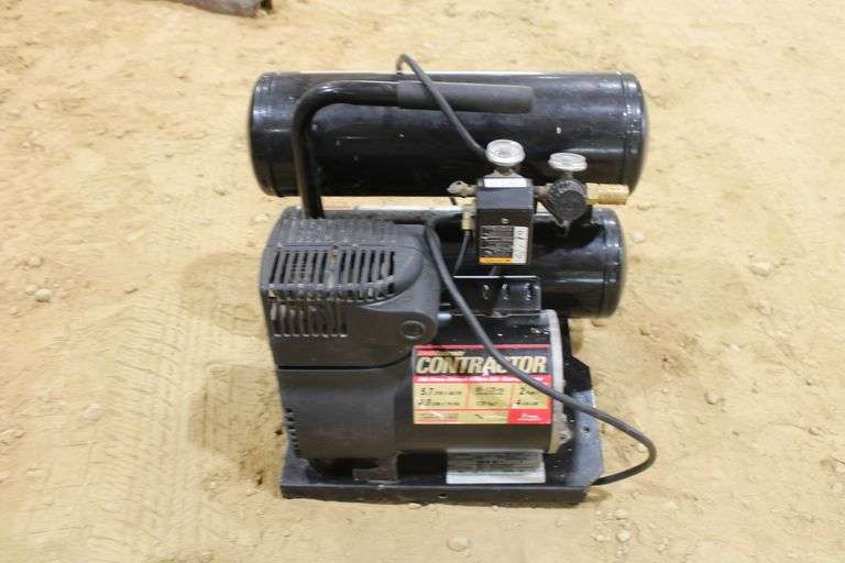 Coleman portable air compressor - Lee Real Estate & Auction Service