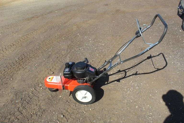 Walk behind string trimmer - Lee Real Estate & Auction Service