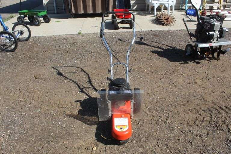 Walk behind string trimmer - Lee Real Estate & Auction Service