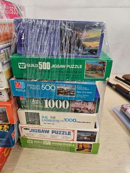22 jig saw puzzles - Lee Real Estate & Auction Service