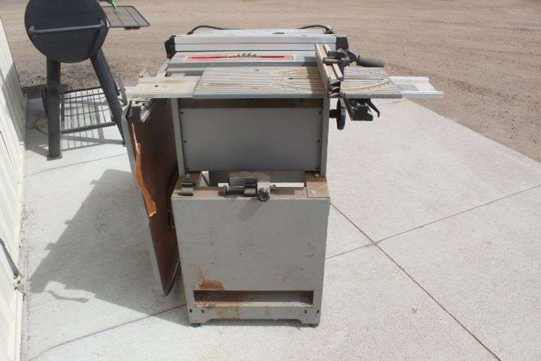 Ryobi 10" elec. table saw w/stand - Lee Real Estate & Auction Service