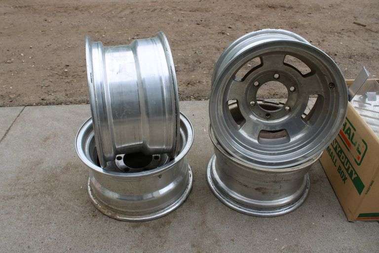 Set of 4 Alum. Chevrolet rims - Lee Real Estate & Auction Service