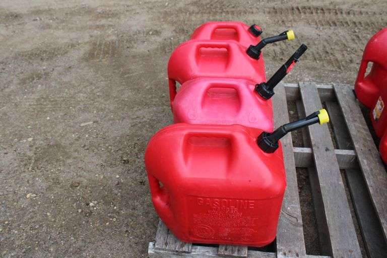 4 - 5 gal. plastic gas cans - Lee Real Estate & Auction Service
