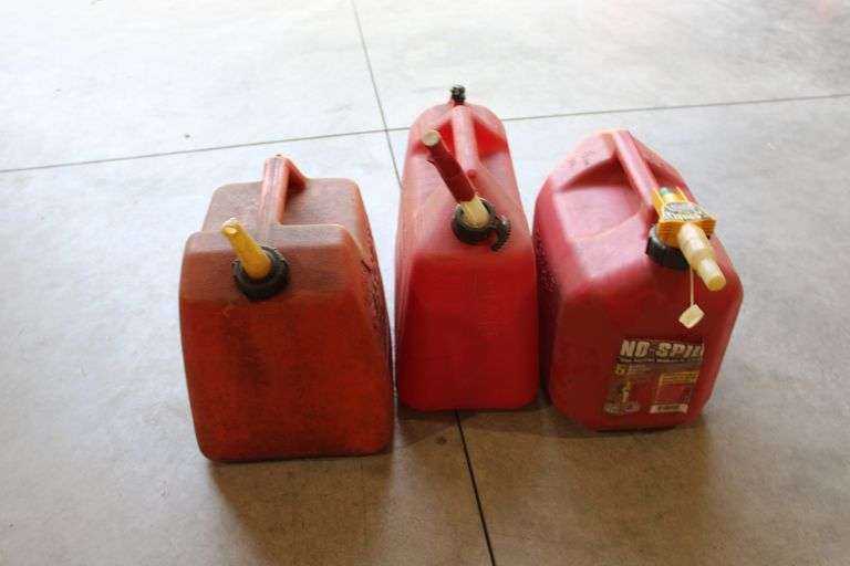 3 - 5 gal. plastic gas cans - Lee Real Estate & Auction Service