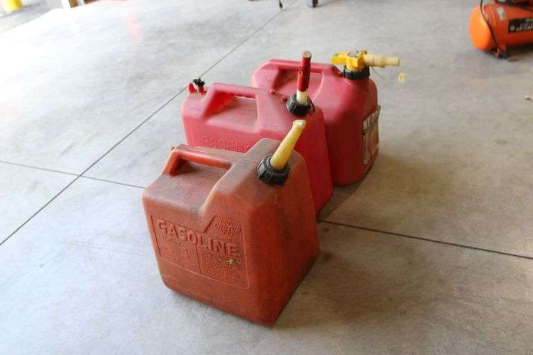 3 - 5 gal. plastic gas cans - Lee Real Estate & Auction Service