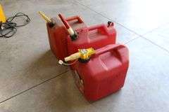 3 - 5 gal. plastic gas cans - Lee Real Estate & Auction Service