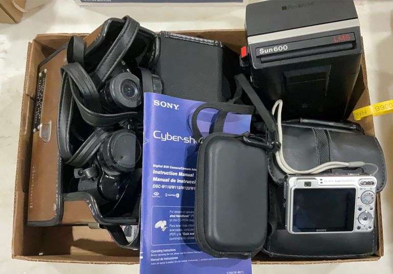 Polaroid camera, binoculars , Sony small digital camera in case ...