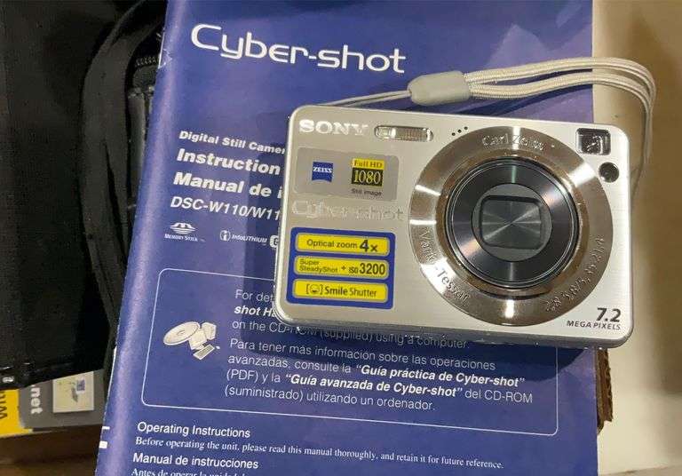 Polaroid camera, binoculars , Sony small digital camera in case ...