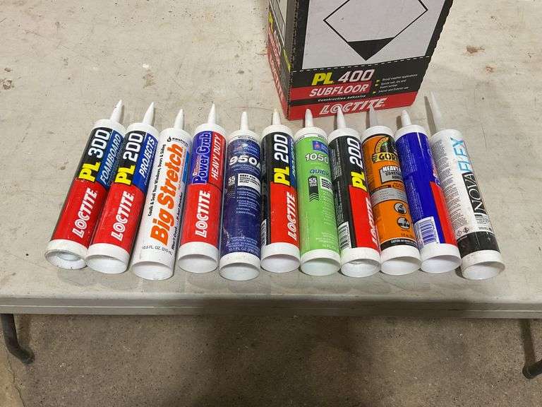 Box of caulk and adhesive - Hamilton-Maring Auction Group