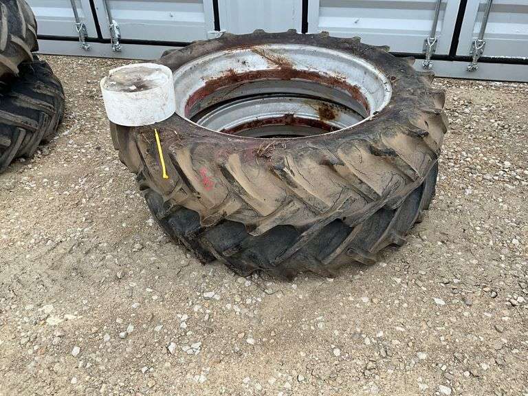 Set of rims & tires off Farmall M - 13.6-38 - Hamilton-Maring Auction Group