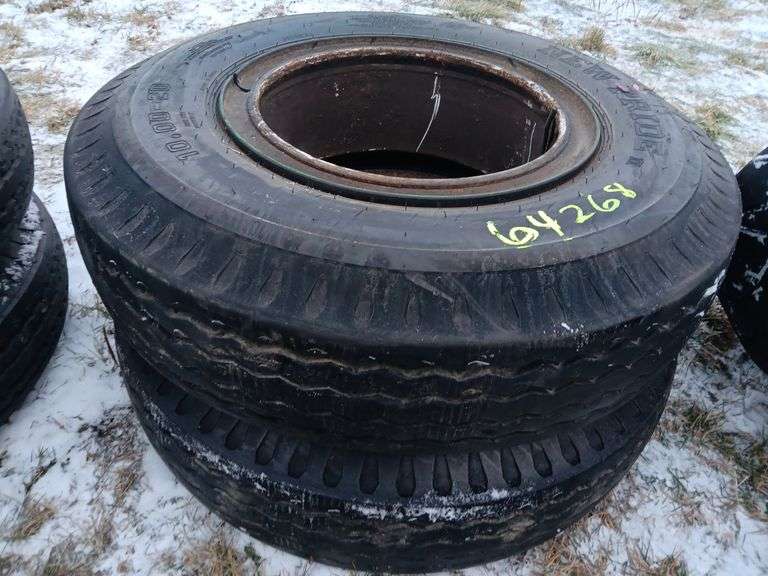 (2)10.00x 20 Tires on split rims - Hamilton-Maring Auction Group