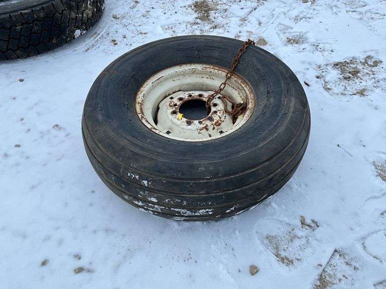 12.5L-15 tire on 6 bolt rim - Hamilton-Maring Auction Group