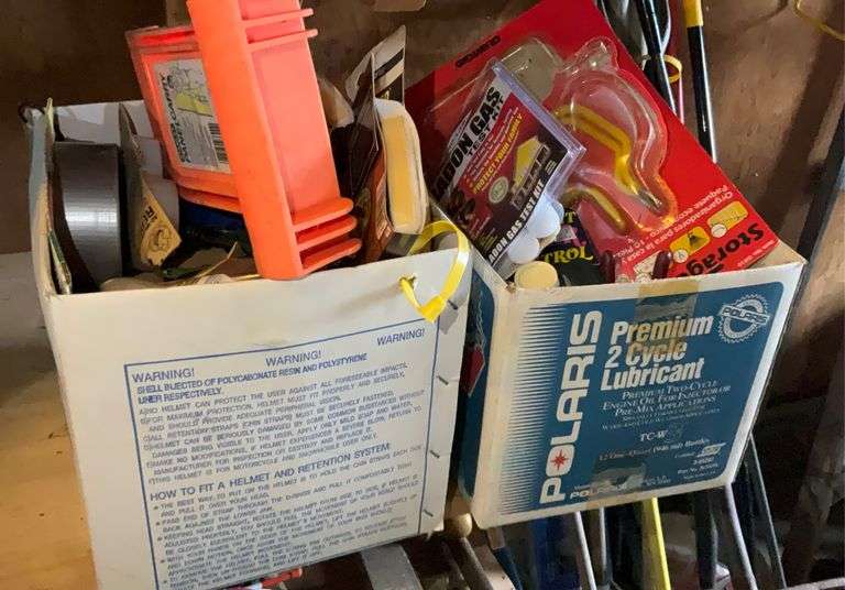 Assortment of bike hooks, painting supplies, home repair items ...