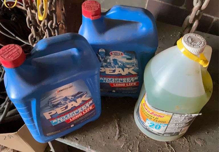 2 gallon jugs of Peak antifreeze and one of windshield washer fluid ...