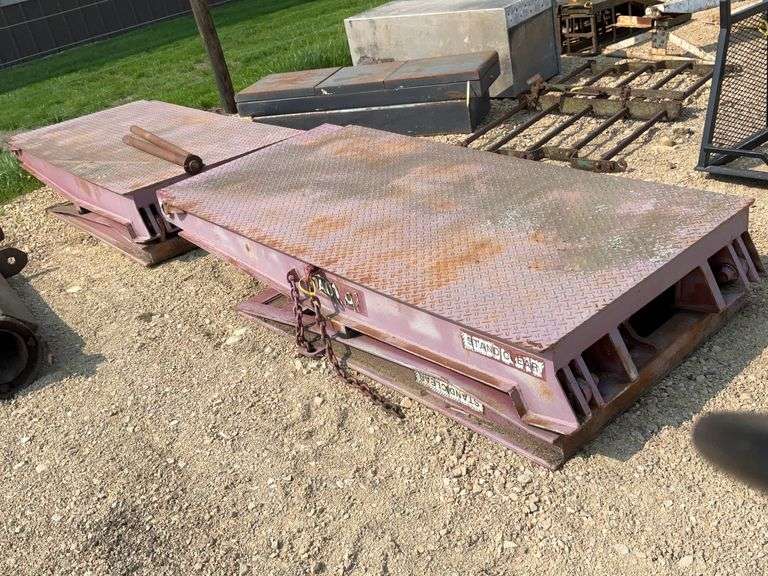 Heavy Duty Bi-Fold Ramps off RGN Trailer - Hamilton-Maring Auction Group