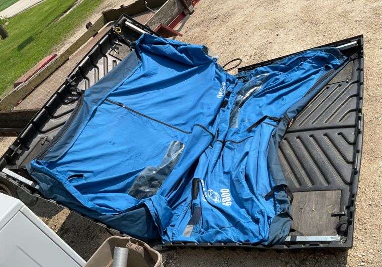 Clam 6800 fish house, damage to canvas - Hamilton-Maring Auction Group