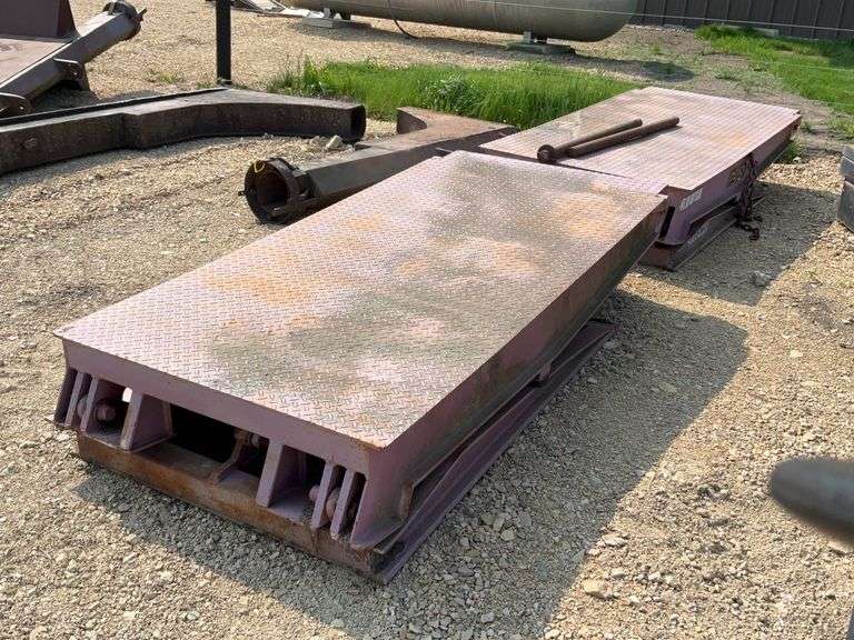 Heavy Duty Bi-Fold Ramps off RGN Trailer - Hamilton-Maring Auction Group