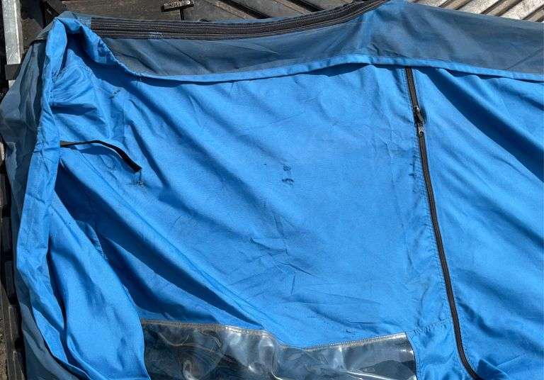 Clam 6800 fish house, damage to canvas - Hamilton-Maring Auction Group