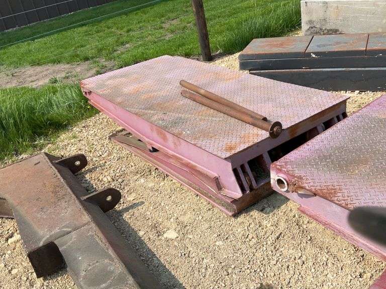 Heavy Duty Bi-Fold Ramps off RGN Trailer - Hamilton-Maring Auction Group