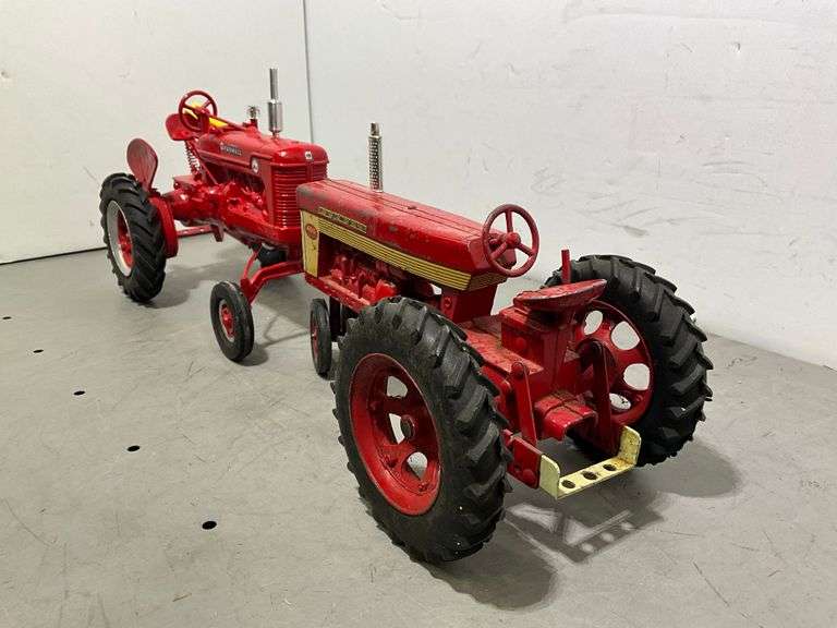 (2) McCormick Farmall toy tractors - Hamilton-Maring Auction Group