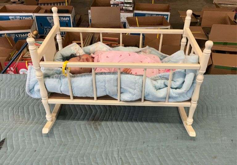 Life-like doll in rocking crib - Hamilton-Maring Auction Group