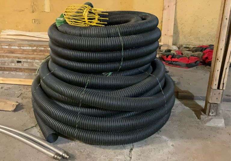 Pile of 4" perforated tile & inlet cage - Hamilton-Maring Auction Group