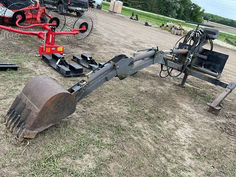 Universal Skid Loader/ 3 Point Backhoe Attachment, - Hamilton-Maring ...