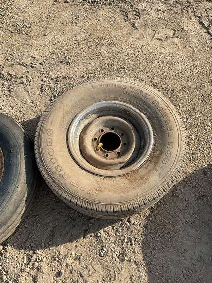 LT265/7.5R16 tire on 8 bolt rim - Hamilton-Maring Auction Group