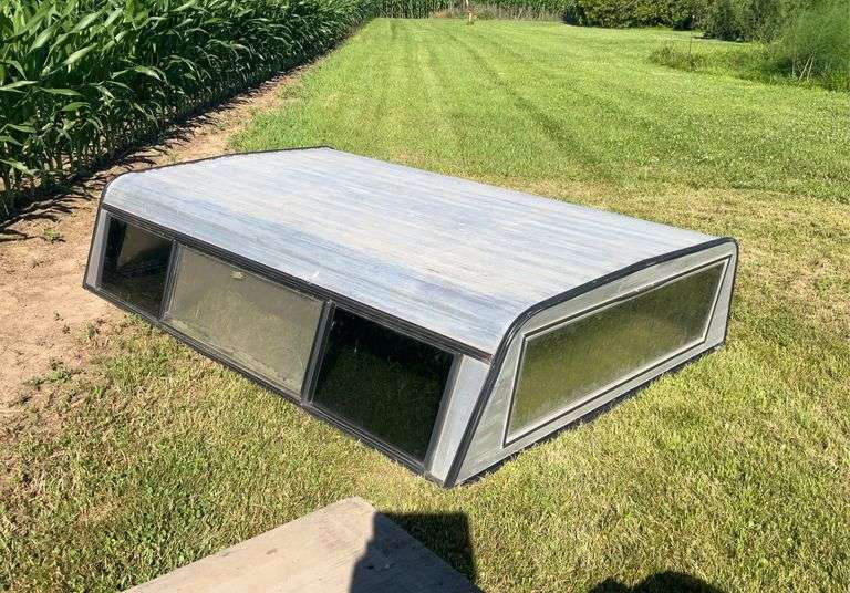 8ft long silver aluminum pick up topper - Hamilton-Maring Auction Group