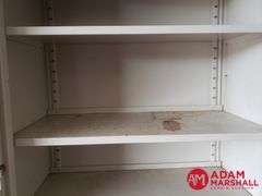 Upright metal cabinet with adjustable shelving. Locking doors with key ...