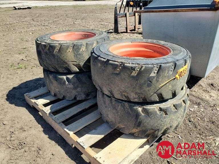 (4) Skid Steer Tires On Rims - Adam Marshall Land & Auction, LLC
