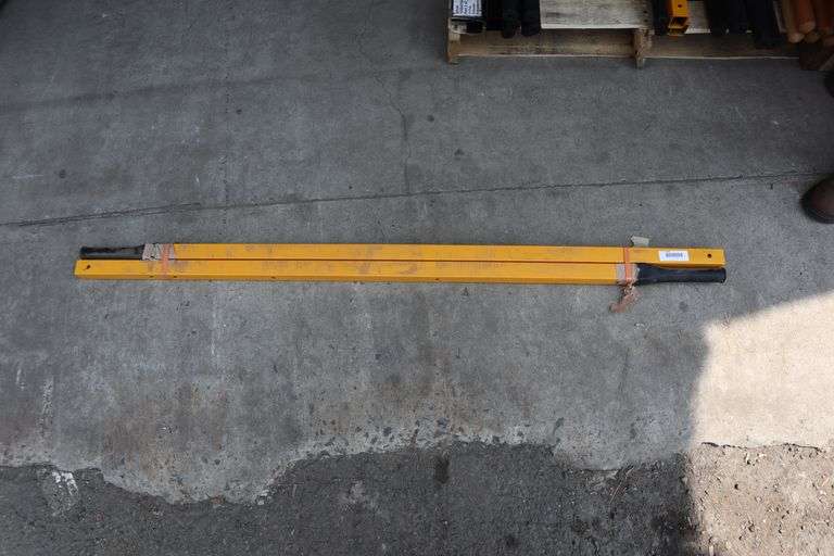 Set of 2 yellow metal wheelbarrow handles - Matthews Auctioneers